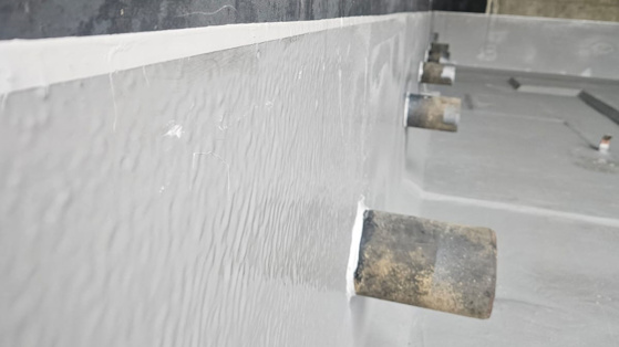 Applying Polyurea Coating to Line a Concrete Bund in Preparation for ...